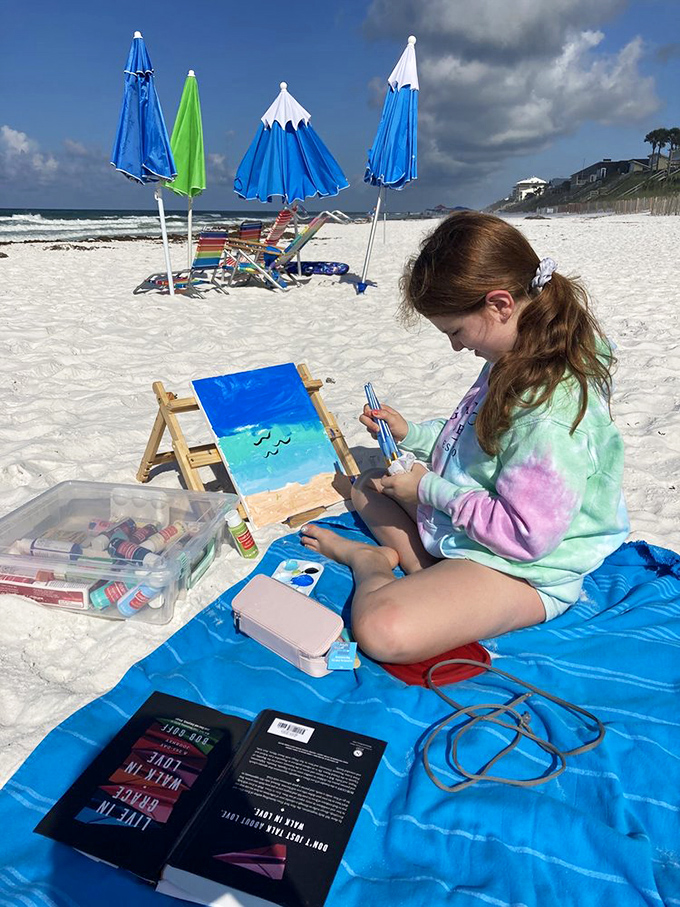 Young artist capturing the scene better than any smartphone ever could—proof that some vacation memories deserve more than just a quick snap.
