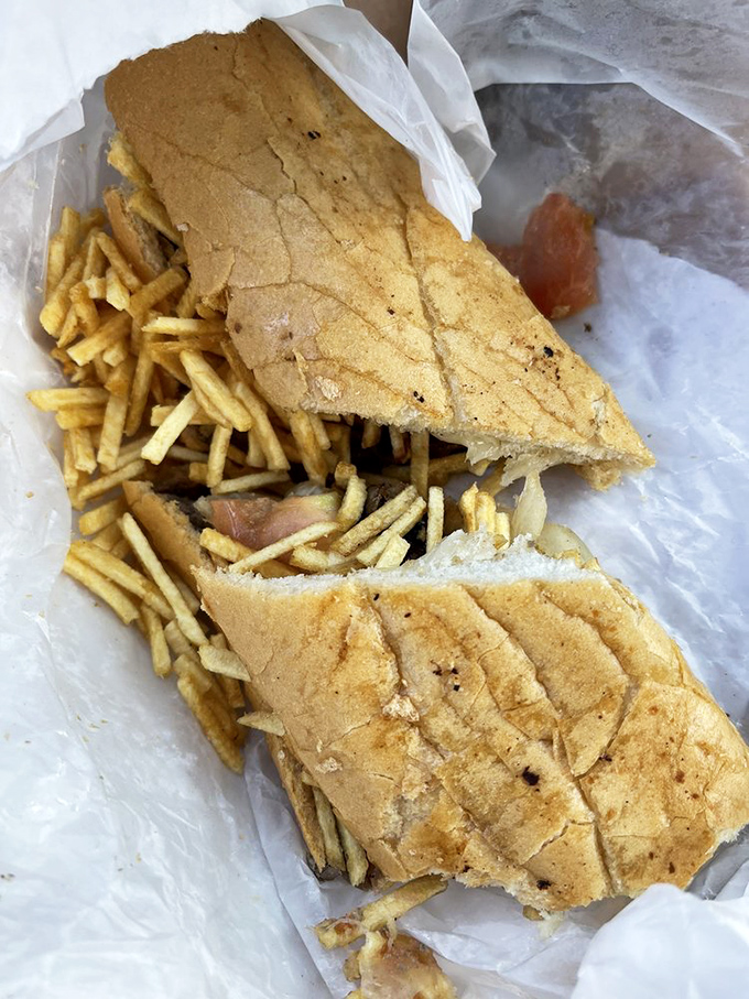 The Pan Con Bistec isn't just a sandwich—it's an engineering marvel where thin-sliced steak, crispy potatoes, and bread achieve perfect harmony.