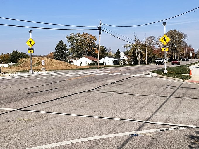 Crosswalks and pedestrian signs—small but significant indicators that this town was designed for humans, not just vehicles rushing through.