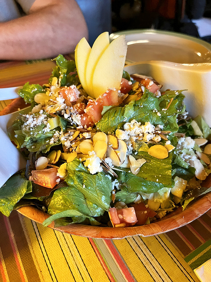 The Satch Salad isn't playing second fiddle to pizza – it's conducting its own orchestra of textures, with nuts and seeds providing the perfect crescendo.