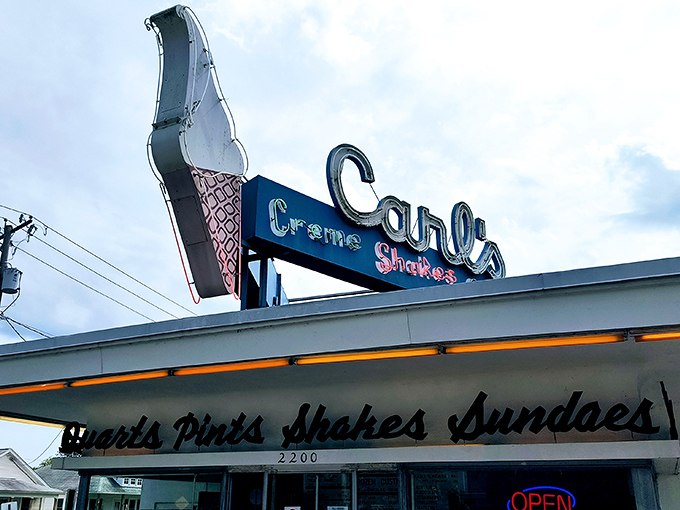 The sign promises three simple pleasures—Creme, Shakes, Sundaes—and delivers them with a perfection that makes you question why we ever needed more options.