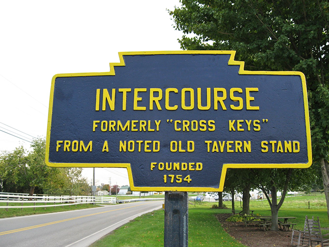 The town sign reveals Intercourse's innocent etymology—a crossroads of commerce rather than the punchline many visitors initially expect.