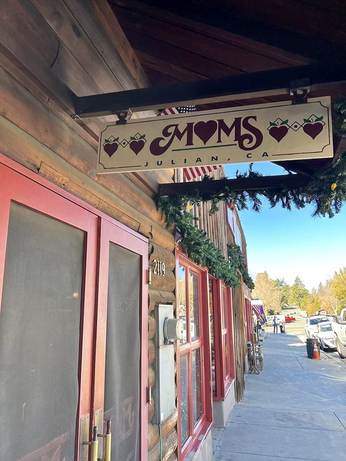 The sign promises what the pies deliver. Those little hearts aren't just decoration—they're a preview of how you'll feel after your first bite.