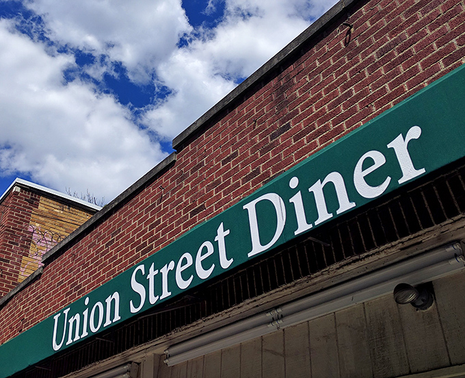 That iconic green awning with bold white lettering against brick – a beacon of hope for the hungry souls of Athens.