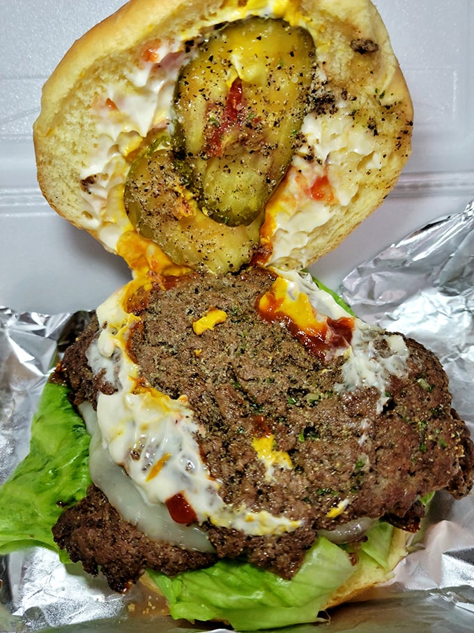 This isn't just a burger—it's a juicy masterpiece topped with melted cheese, fresh veggies, and a pickle that ties it all together.