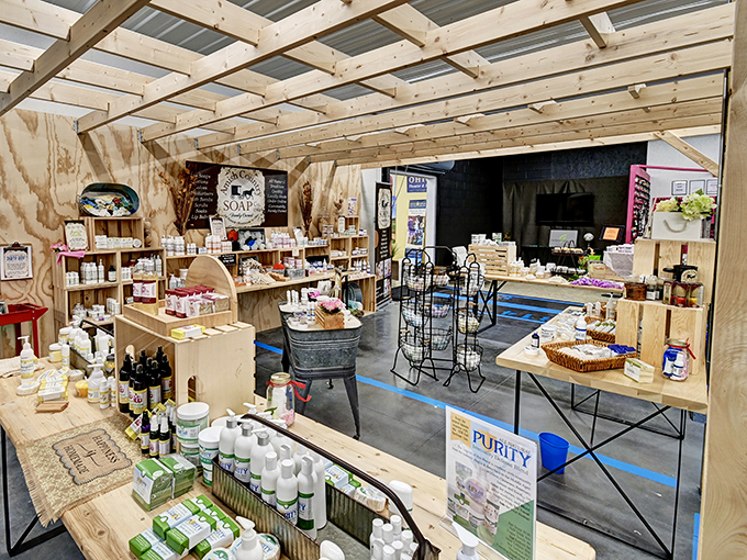 Handmade soaps and natural products line wooden shelves in this booth, promising cleanliness with a side of countryside charm.
