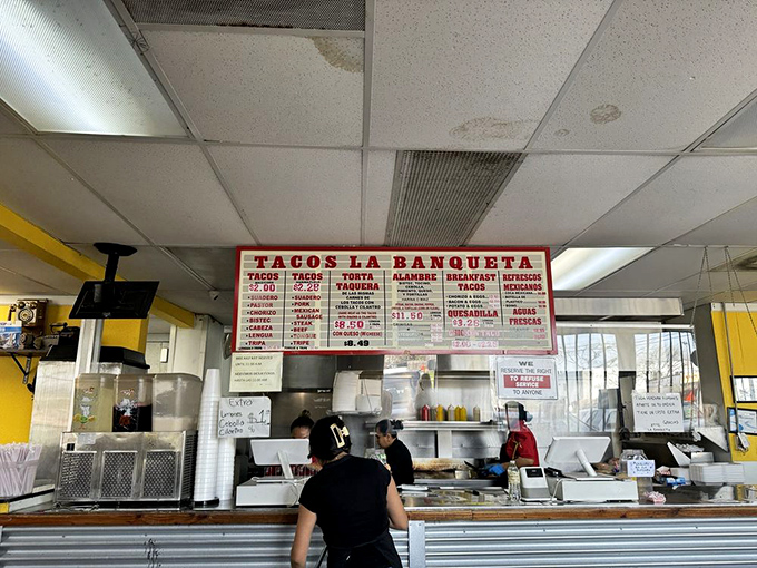 Where the magic happens – the open kitchen layout lets you witness the artistry behind each perfect taco. These aren't cooks; they're culinary conductors.