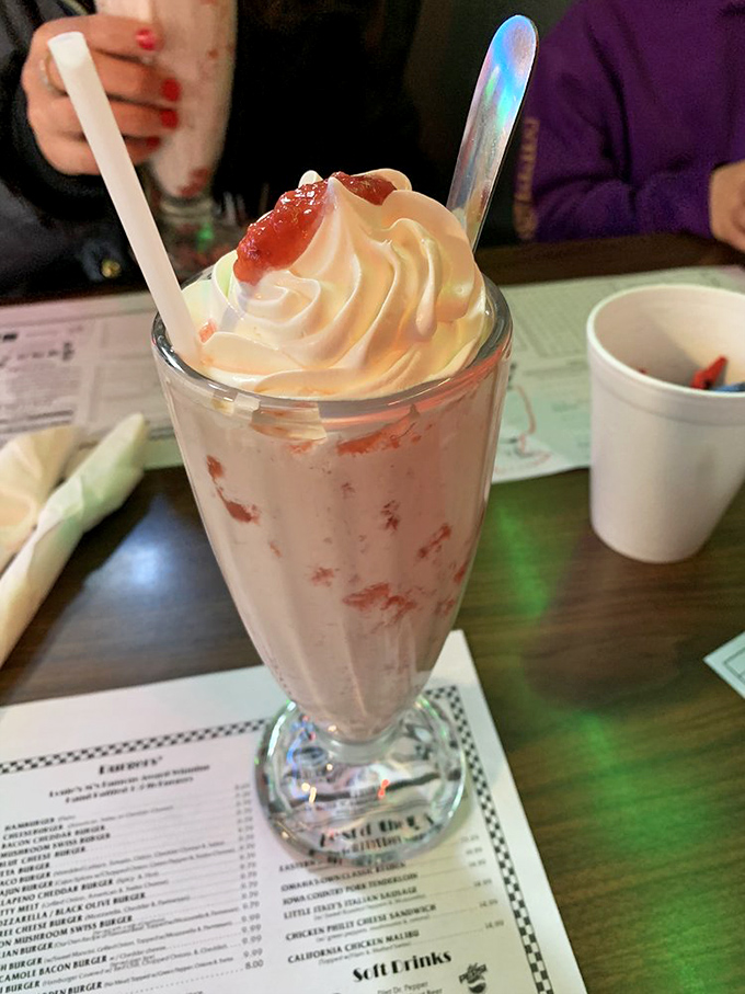 A strawberry malt that transports you straight back to 1955. That swirl of whipped cream and cherry on top isn't just garnish—it's time travel.