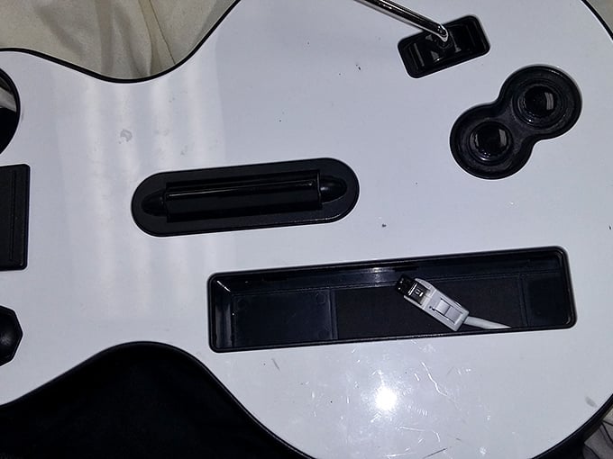 Yesterday's entertainment becomes tomorrow's retro gaming night—this Guitar Hero controller just needs someone to make it a rock star again.
