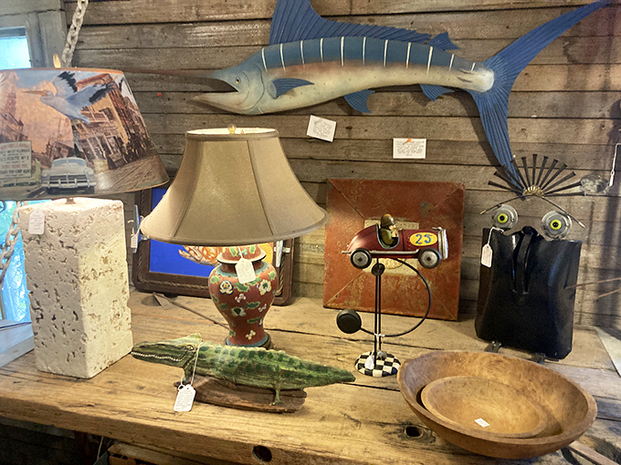 A wooden marlin watches over an eclectic collection that includes a whimsical race car lamp – proving that in this shop, nautical and whimsy coexist beautifully.