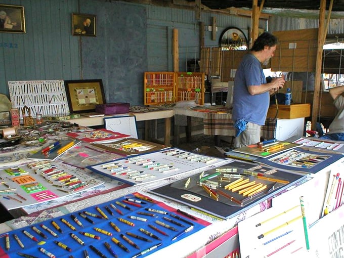A rainbow array of vintage pens and pencils meticulously displayed—because someone out there collects everything, and thank goodness they do.