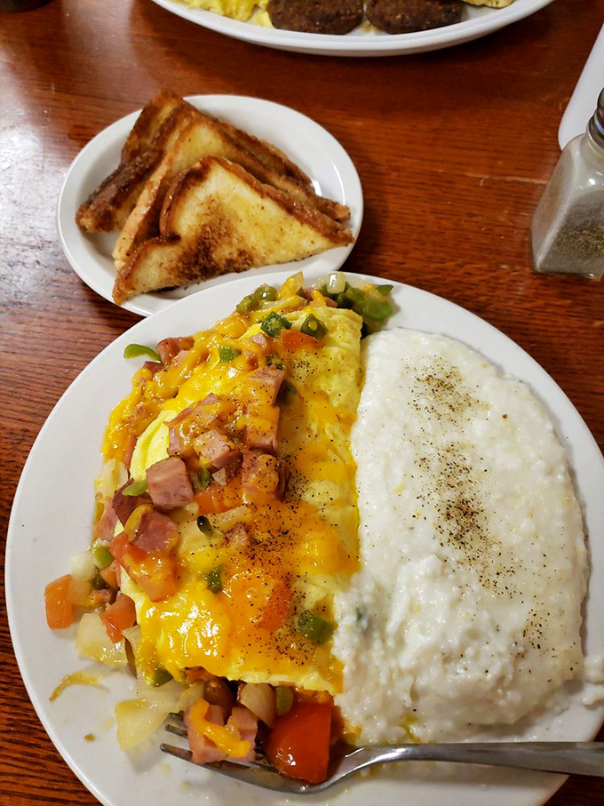 Western omelets are the cowboys of breakfast—rugged, colorful, and full of character. This one rides alongside creamy grits like they've been partners for years.