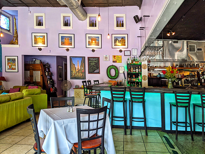 Art-filled walls and that signature blue bar create a space where "just one drink" inevitably turns into "let's see a dessert menu."