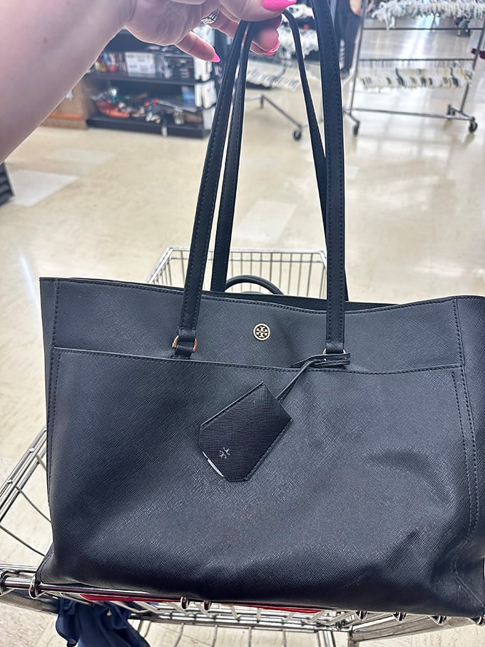 That's not just any black tote – it's a designer bag that somehow landed in thrift store territory. The thrill of the find is sweeter than the savings.