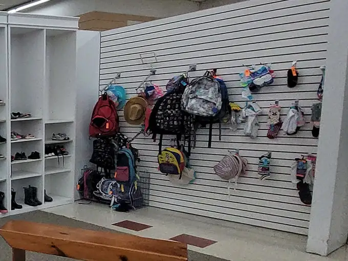 Backpacks and bags hang like colorful fruit, ripe for the picking. School supplies with stories to tell and adventures yet to have.