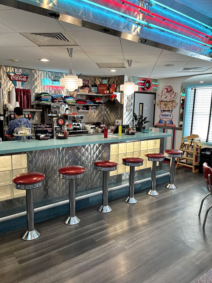 The counter where dreams come true—classic soda fountain stools, gleaming chrome, and the promise of milkshakes that will ruin all other milkshakes for you.