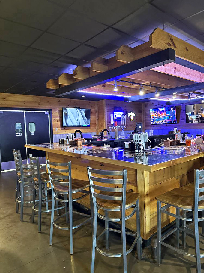 The bar area strikes that perfect balance between "watching the game" and "having a conversation"—with wood and metal creating a modern rustic vibe.
