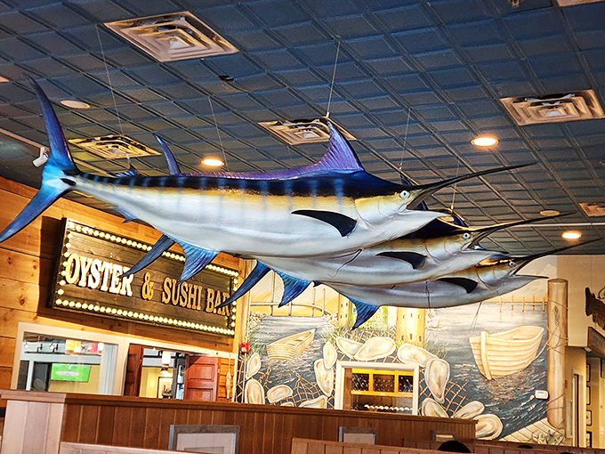 Look up! Those magnificent marlins suspended from the ceiling are silently judging your seafood-ordering prowess.