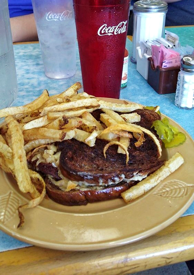 A patty melt that's seen the grill, known the cheese, and emerged transformed. The fries are just showing off at this point.