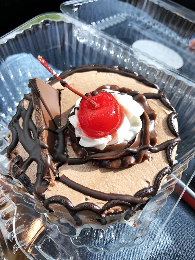 This chocolate cheesecake could make even the most composed food critic weep with joy—a cherry-topped masterpiece of texture and balance.