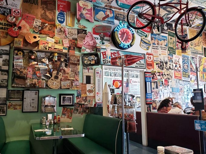 The mint-green booths aren't just seating—they're front-row tickets to the greatest show on earth: American diner culture in full swing.