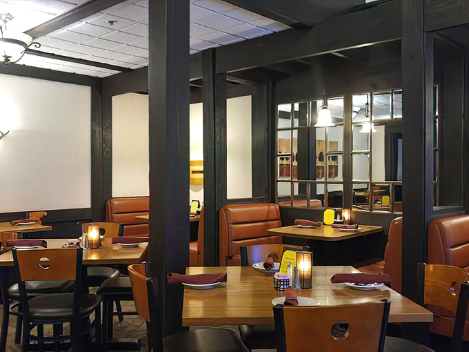 Cozy booths and warm lighting create the perfect backdrop for important life decisions—like whether to order dessert after demolishing a 16-ounce steak.