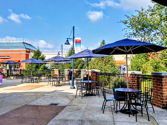 The outdoor dining area: where exhausted shoppers rest their feet, refuel with caffeine, and strategize their next retail conquest.