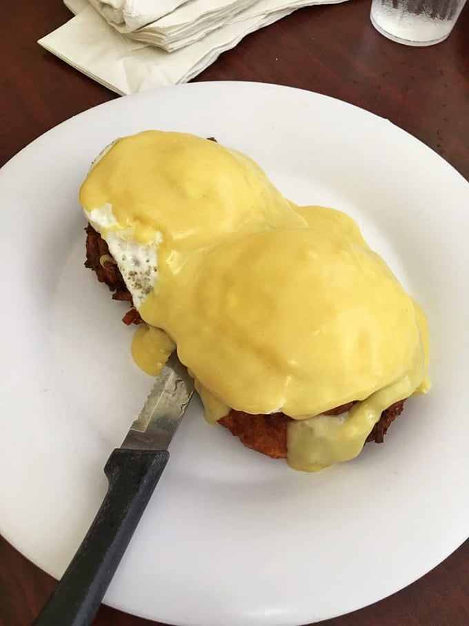 Eggs Benedict that would make a brunch snob weep with joy – perfectly poached eggs nestled under a hollandaise blanket of sunshine.