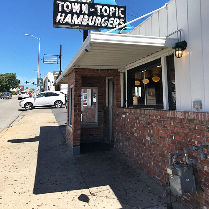 The unassuming entrance doesn't prepare you for the flavor explosion waiting inside—like finding a portal to burger paradise on an ordinary street.