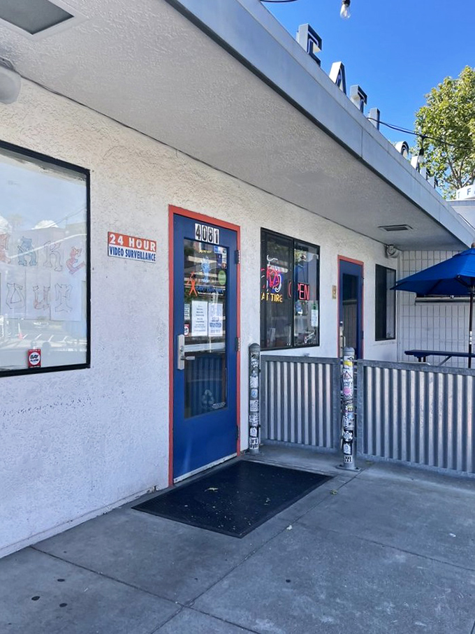 The blue door entrance stands like a portal to breakfast nirvana – simple, unassuming, yet promising culinary delights that keep locals coming back.