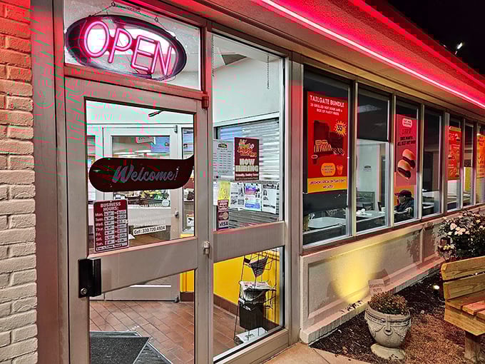 The neon "OPEN" sign might as well say "WELCOME HOME" – a doorway to comfort food that never goes out of style.