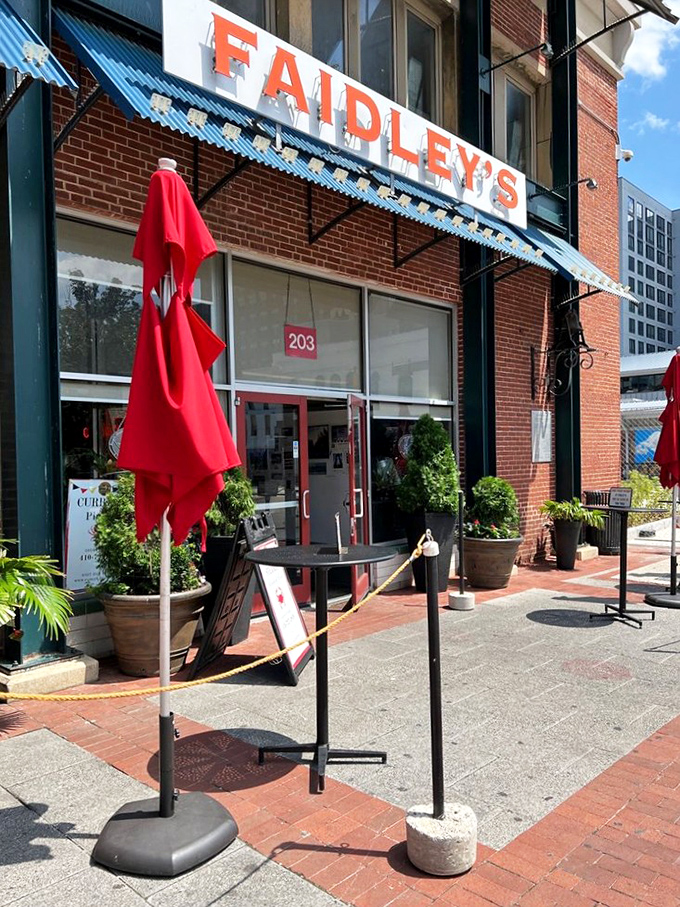 The entrance to seafood paradise, complete with red umbrellas standing guard like sentinels protecting Baltimore's culinary treasure.