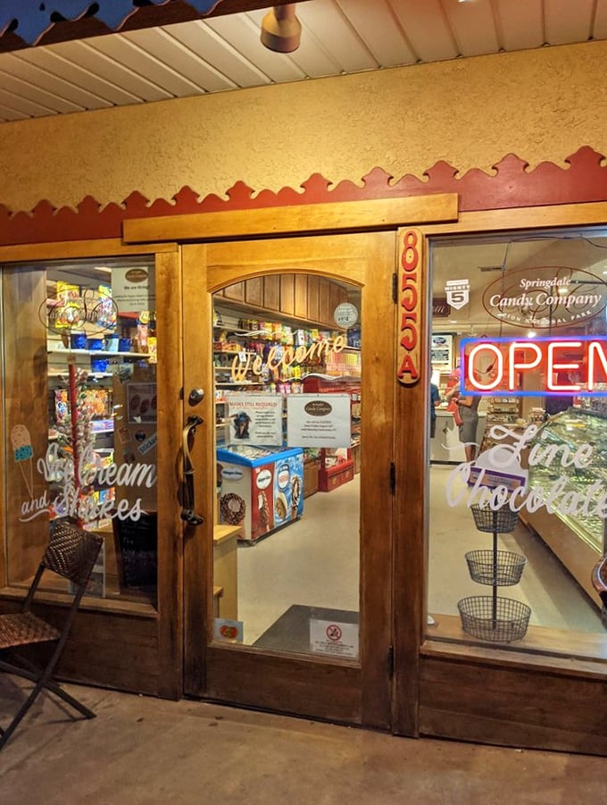 Evening glow welcomes sugar-seekers. The warm, inviting entrance promises sweet escapes and temporary amnesia about your diet resolutions.