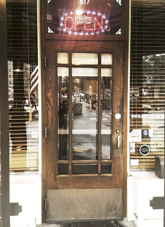 The entrance to Eddie's Place – where that glowing "OPEN" sign might as well read "Come in, we've been expecting you."