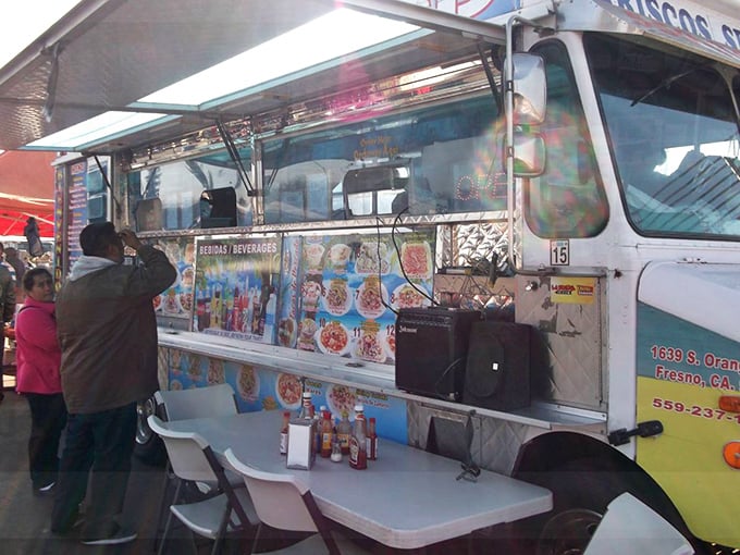 Culinary magic happens curbside at this mobile feast factory—where the shortest distance between hunger and happiness is a quick transaction at the window.