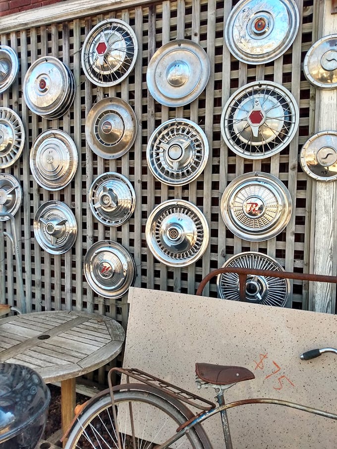 Detroit's finest wheel covers transformed into industrial wall art—automotive history displayed with an artistic flair that would impress any gearhead.