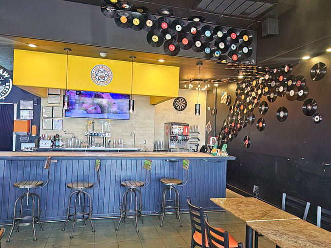 The thoughtful interior design balances modern elements with warmth—much like how a great burger balances savory, sweet, and tangy notes.