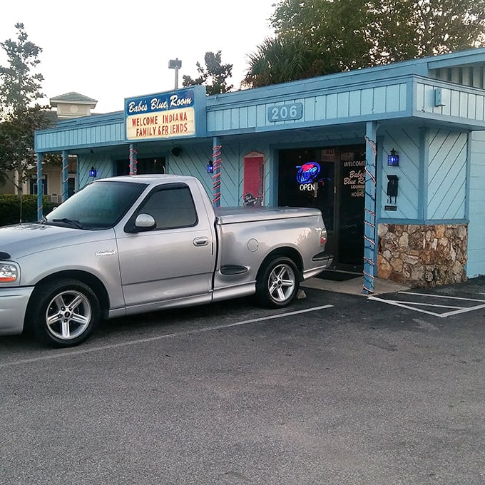 Parking spot perfection—close enough to smell what's cooking. The neon "Open" sign serves as a beacon for hungry souls.