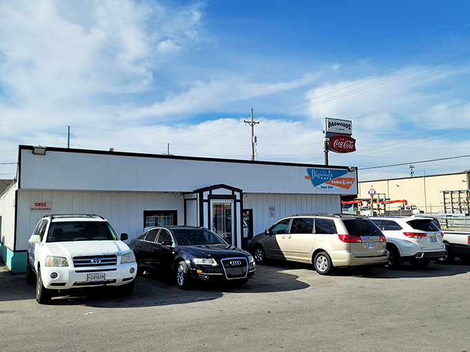 Even luxury cars line up in Dagwood's lot – proof that good taste in food transcends all other status symbols.