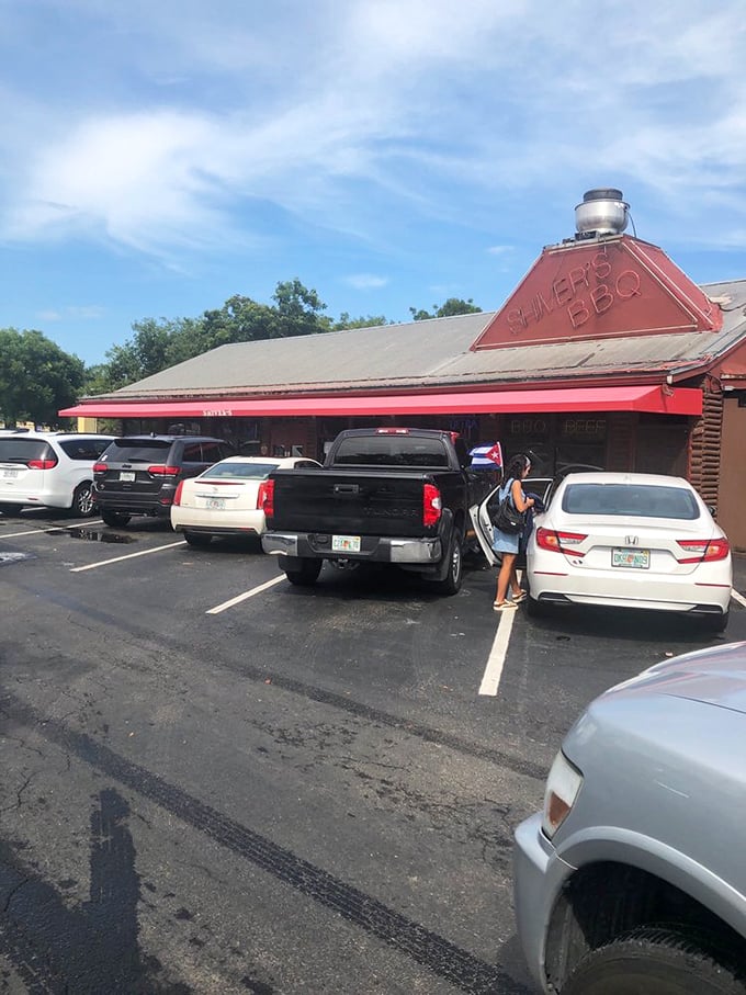 A parking lot that's seen its share of barbecue pilgrimages – each space a temporary home for vehicles carrying soon-to-be-satisfied customers.