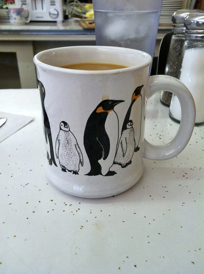 Your morning coffee served with personality. Eddie's mug lottery might pair you with penguins today, vintage advertising tomorrow – each sip a different experience.
