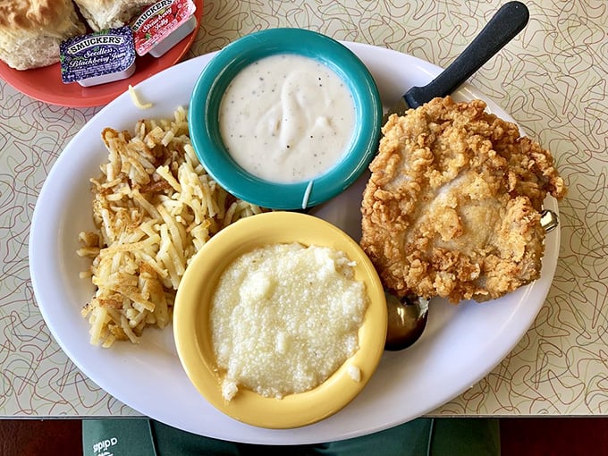 Southern comfort on a plate: crispy pork, creamy grits, and gravy that should be declared a national treasure. Diet culture doesn't exist inside these walls.