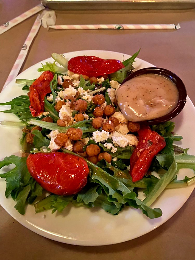A salad that doesn't apologize for being at a barbecue joint. Those roasted tomatoes and crispy chickpeas are playing in the big leagues now.