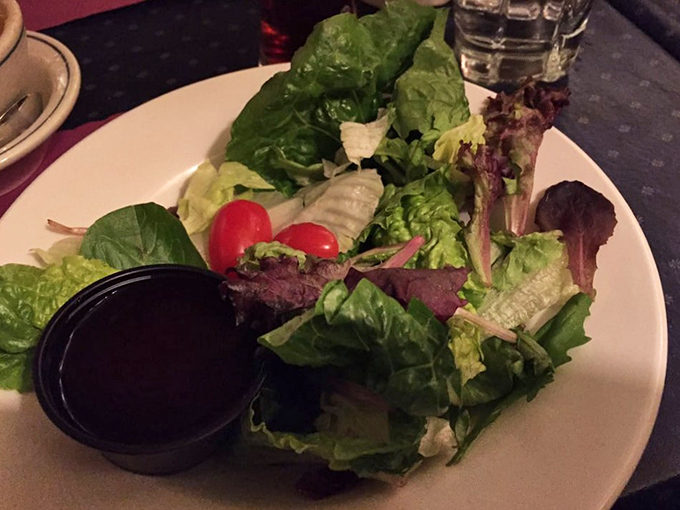A garden-fresh salad that doesn't apologize for being healthy—crisp greens playing the perfect opening act before the meaty main event.