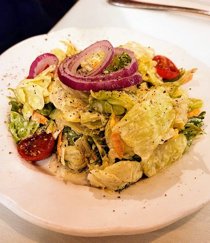 A salad that doesn't apologize for existing at a steakhouse—fresh, crisp, and surprisingly photogenic.