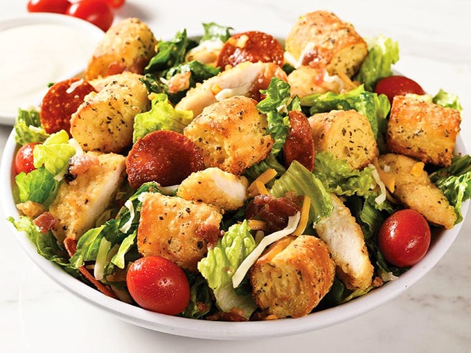 This isn't just any salad – it's the "I should probably eat something green" option that somehow still delivers Italian flavors with every perfectly dressed bite.