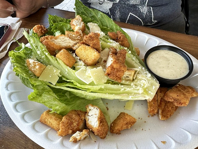 A Caesar salad that doesn't mess around—crisp romaine, house-made croutons, and enough fried seafood to make a nutritionist look the other way.