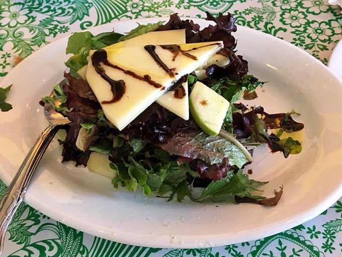 A salad that understands its supporting role in the meal—fresh, bright, and just assertive enough to hold its own against pizza's star power.