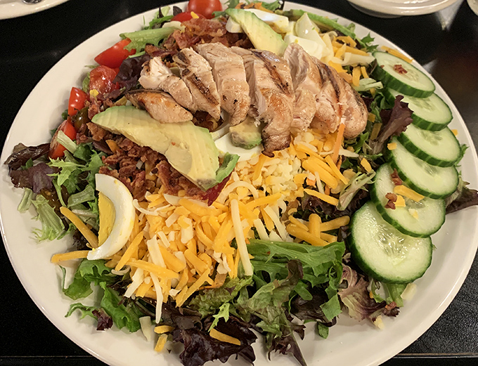 A salad so substantial it deserves its own zip code—proof that health-conscious options don't have to feel like punishment at The Dish.