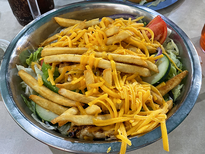 Not your average salad – this Pittsburgh-style creation throws convention to the wind by crowning fresh greens with crispy fries and a shower of cheese.